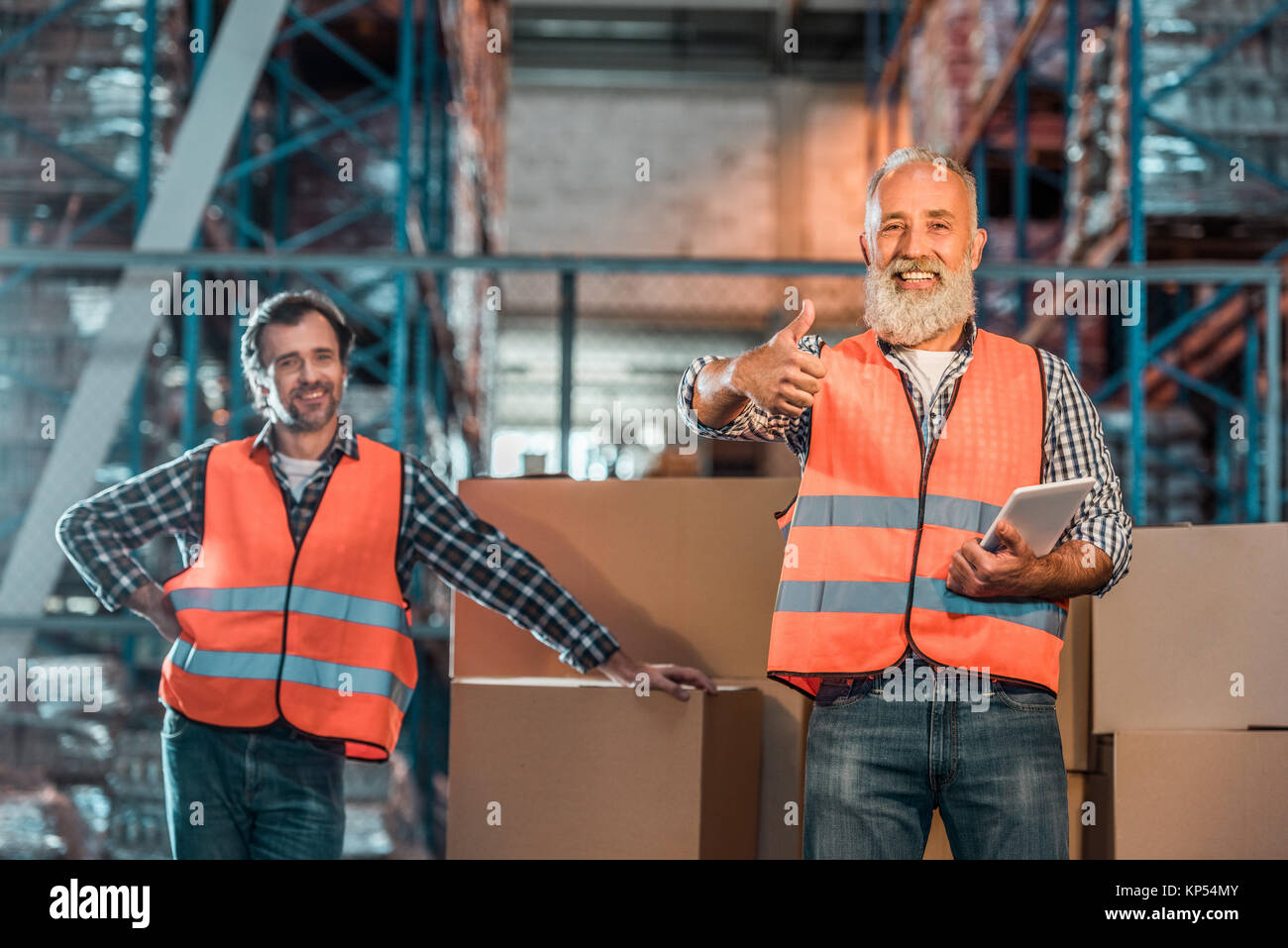 warehouse workers with digital tablet Stock Photo - Alamy
