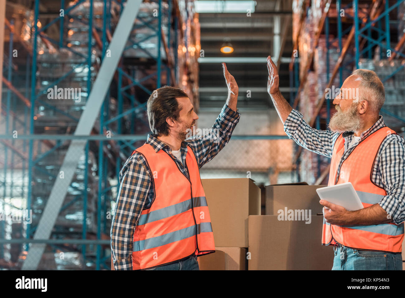 warehouse workers with digital tablet Stock Photo - Alamy