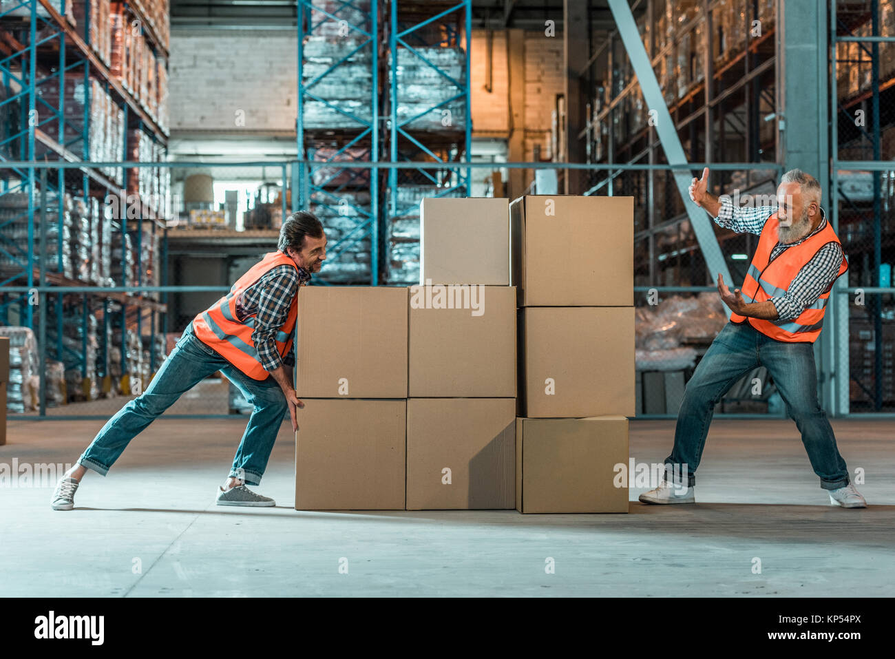 warehouse workers moving boxes Stock Photo - Alamy