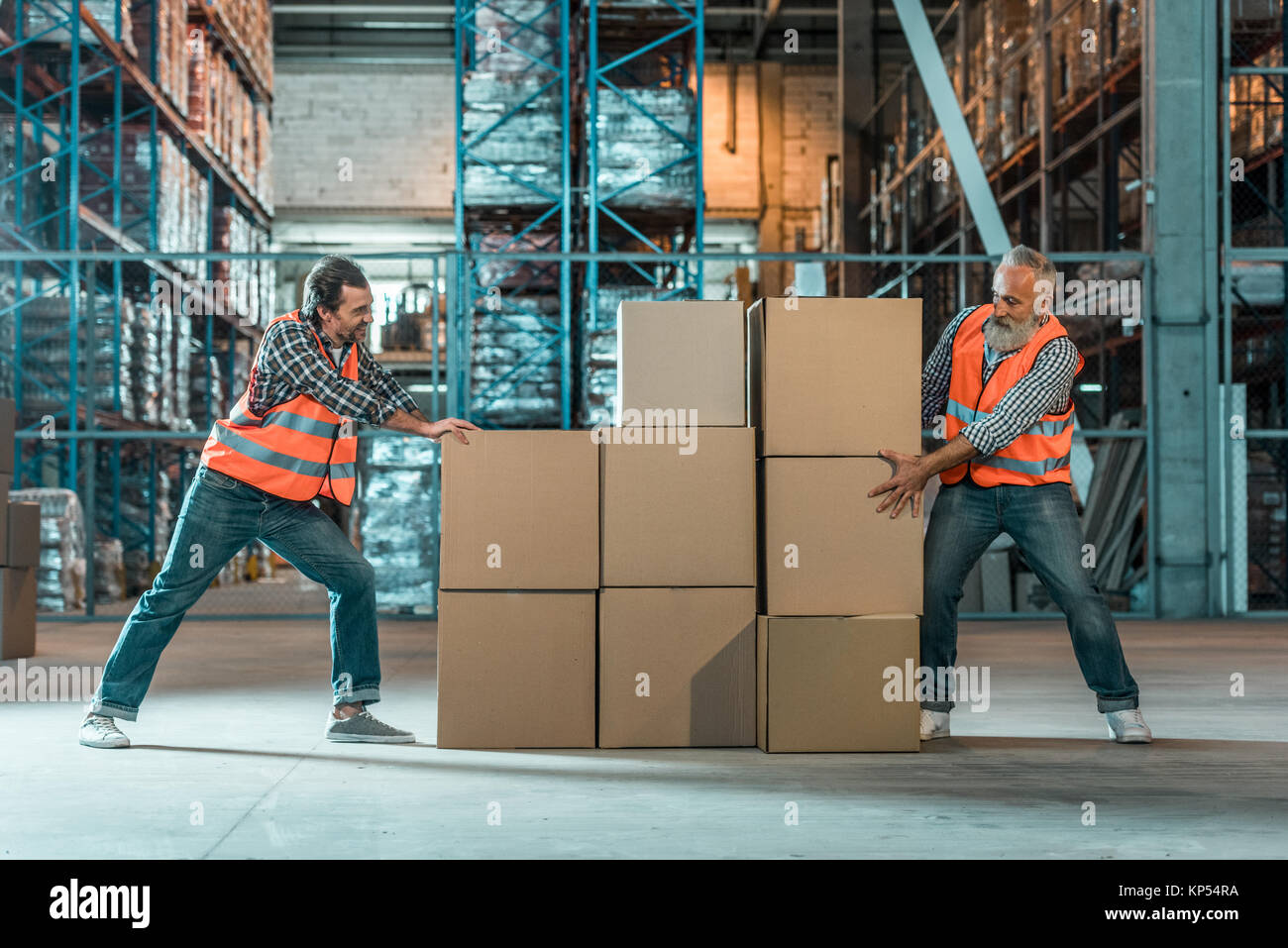 warehouse workers moving boxes Stock Photo - Alamy