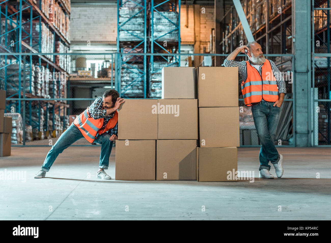 warehouse workers moving boxes Stock Photo - Alamy
