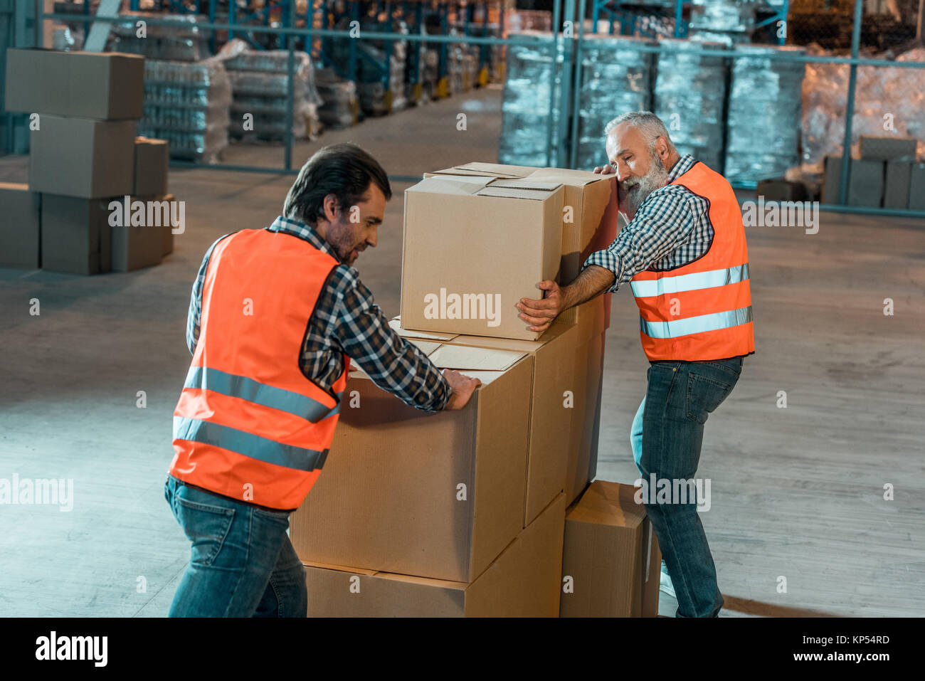 warehouse workers moving boxes Stock Photo - Alamy