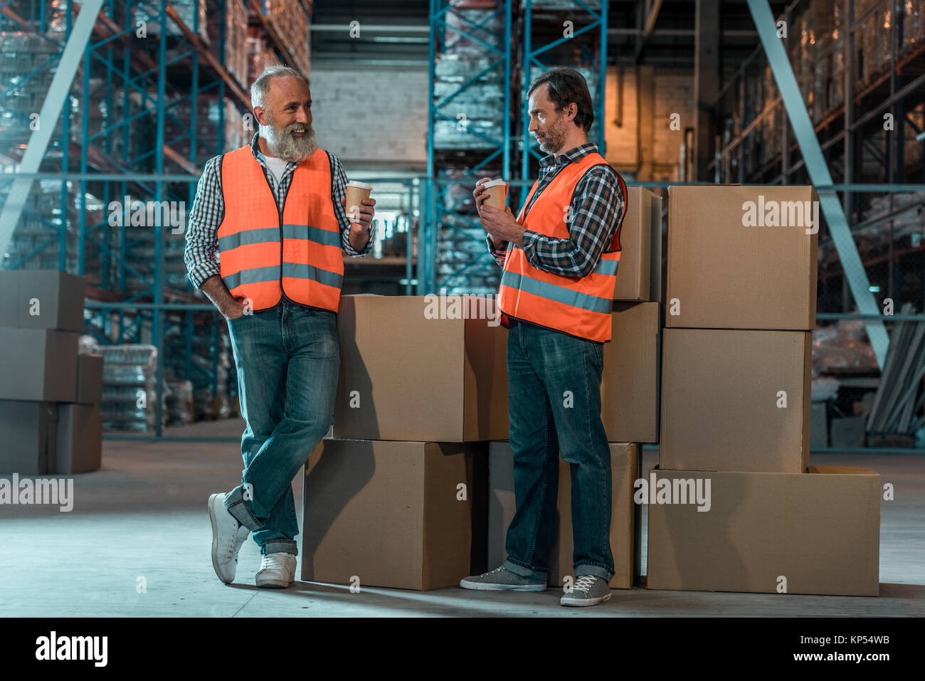 warehouse workers drinking coffee Stock Photo - Alamy