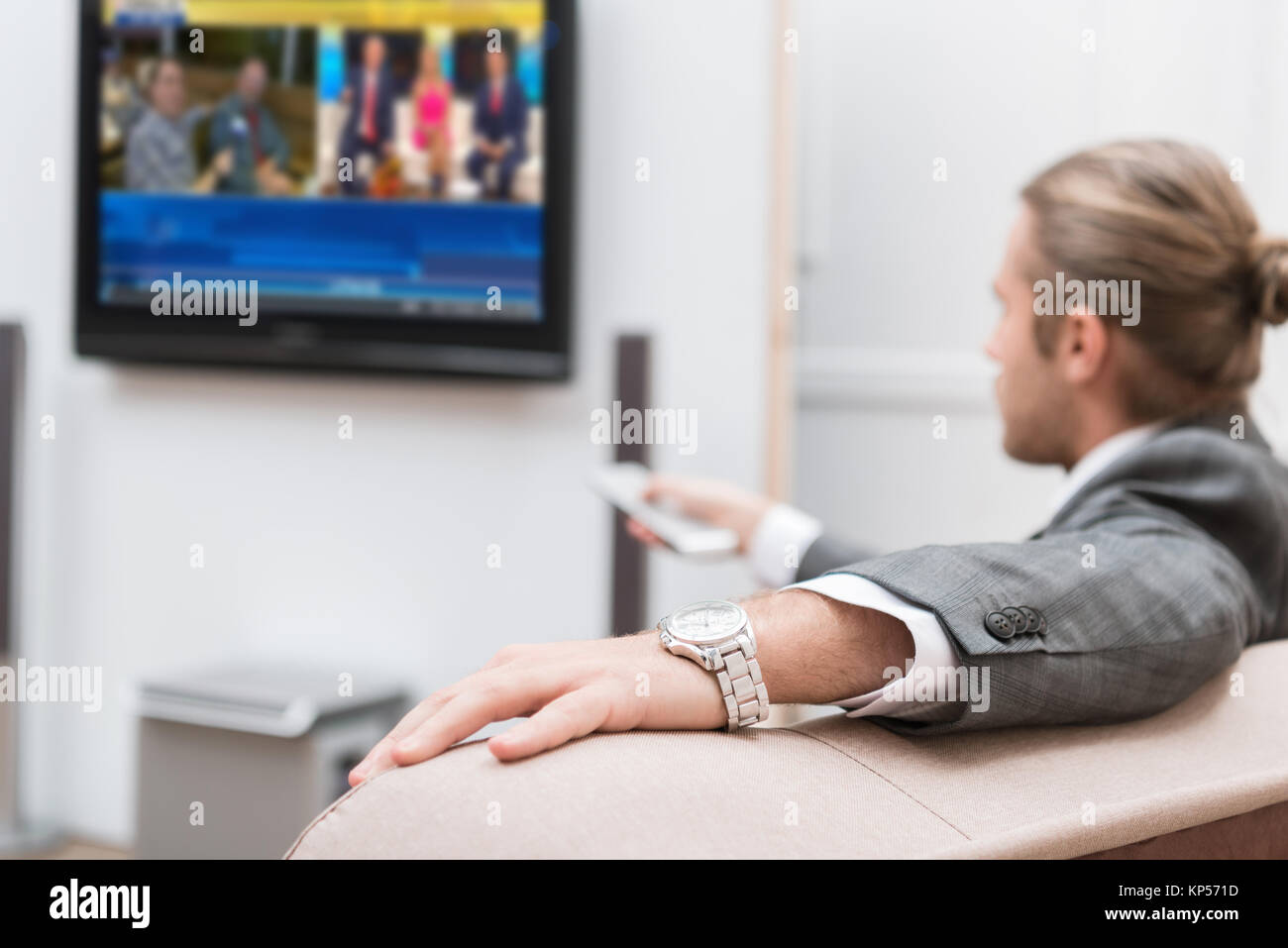 Businessman watching tv home hi-res stock photography and images - Alamy