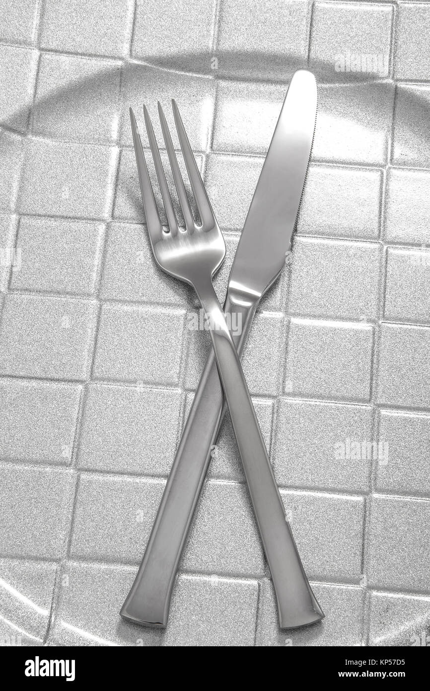 Silver cutlery background Stock Photo - Alamy