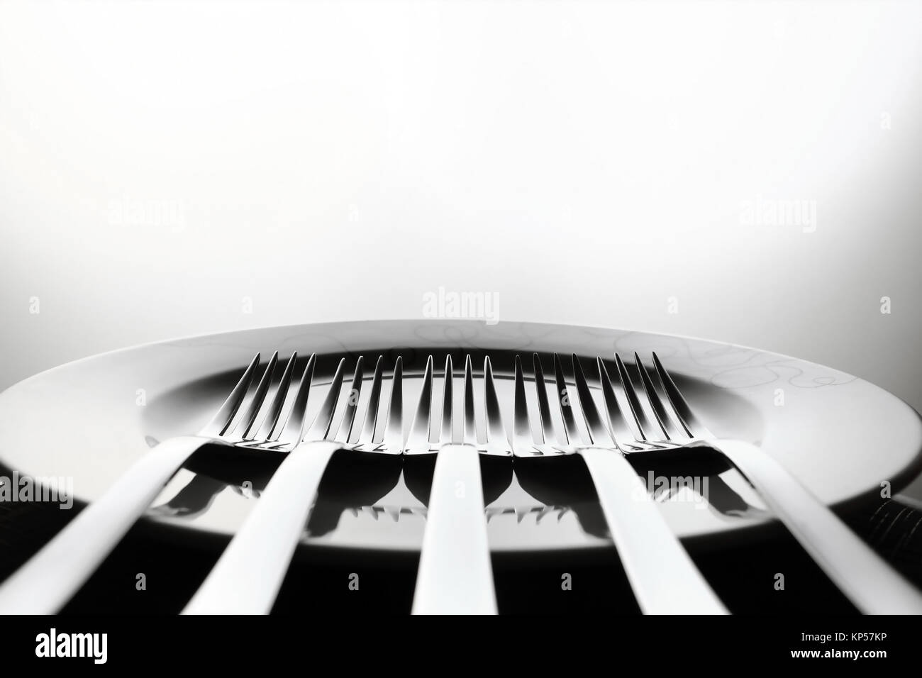 Dish and forks Stock Photo - Alamy