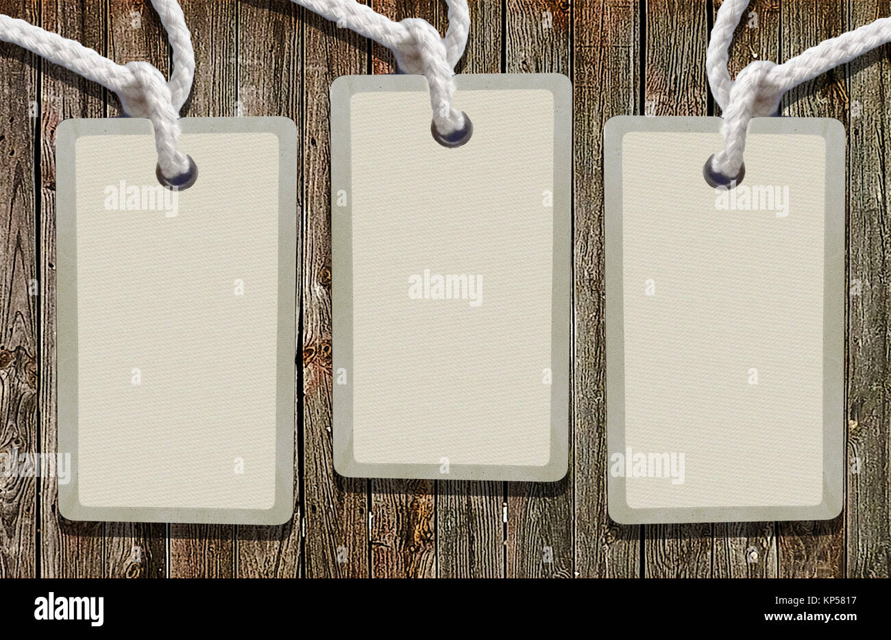 Three cardboard stickers photo templates in wood background Stock Photo ...