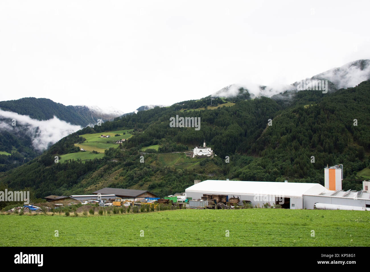 Factory and construction site grass field near Burgusio or Burgeis ...