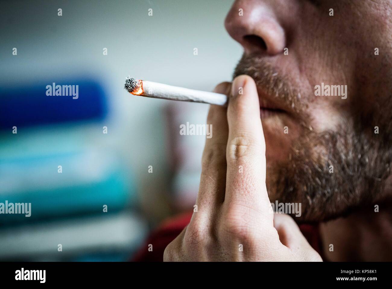 Man smoking a joint Stock Photo - Alamy