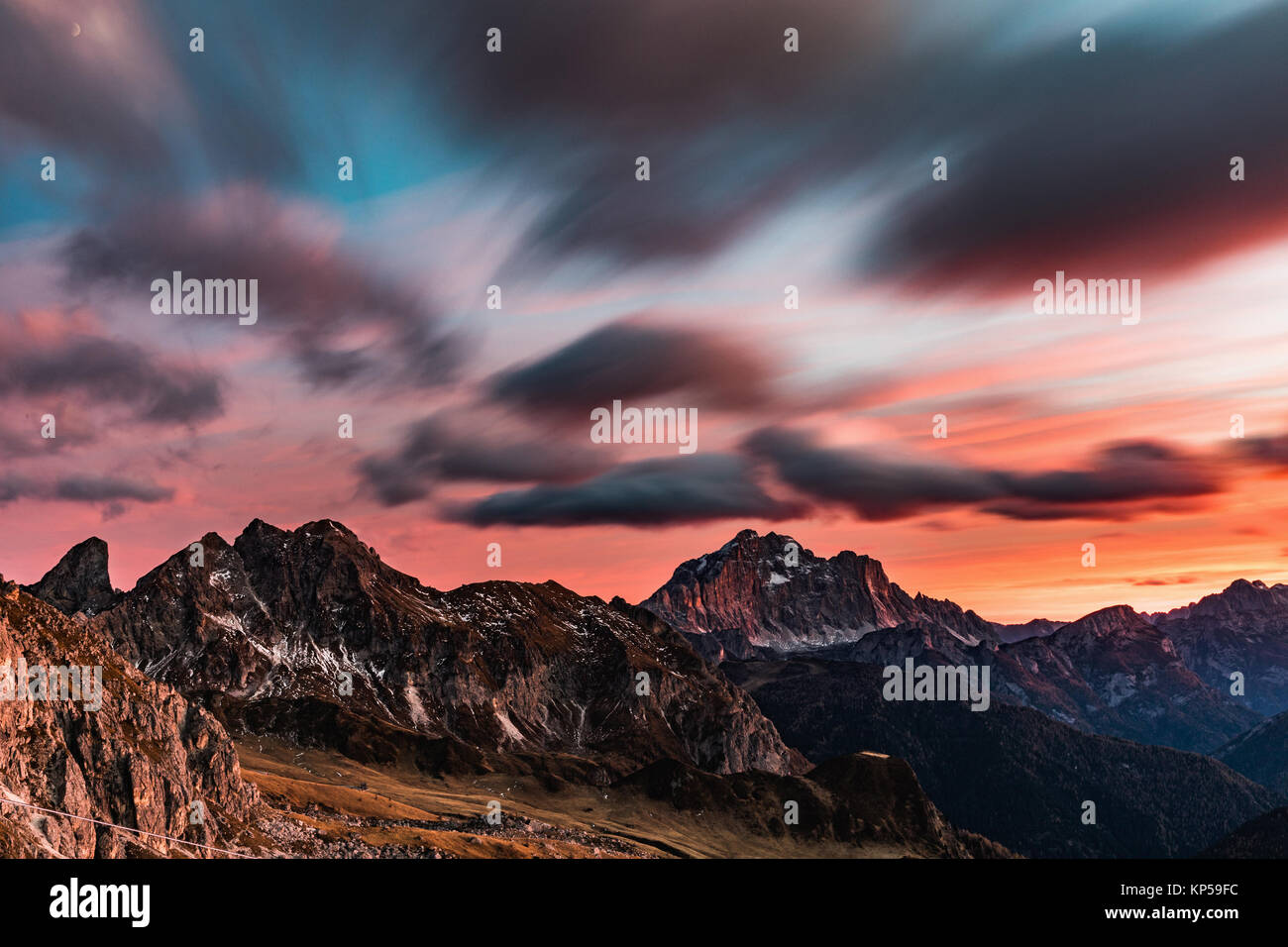 Colorful sunset in the background Dolomites and clouds in motion ...