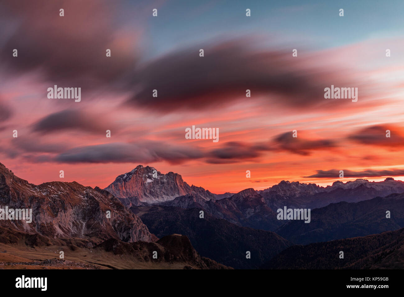 Colorful sunset in the background Dolomites and clouds in motion ...