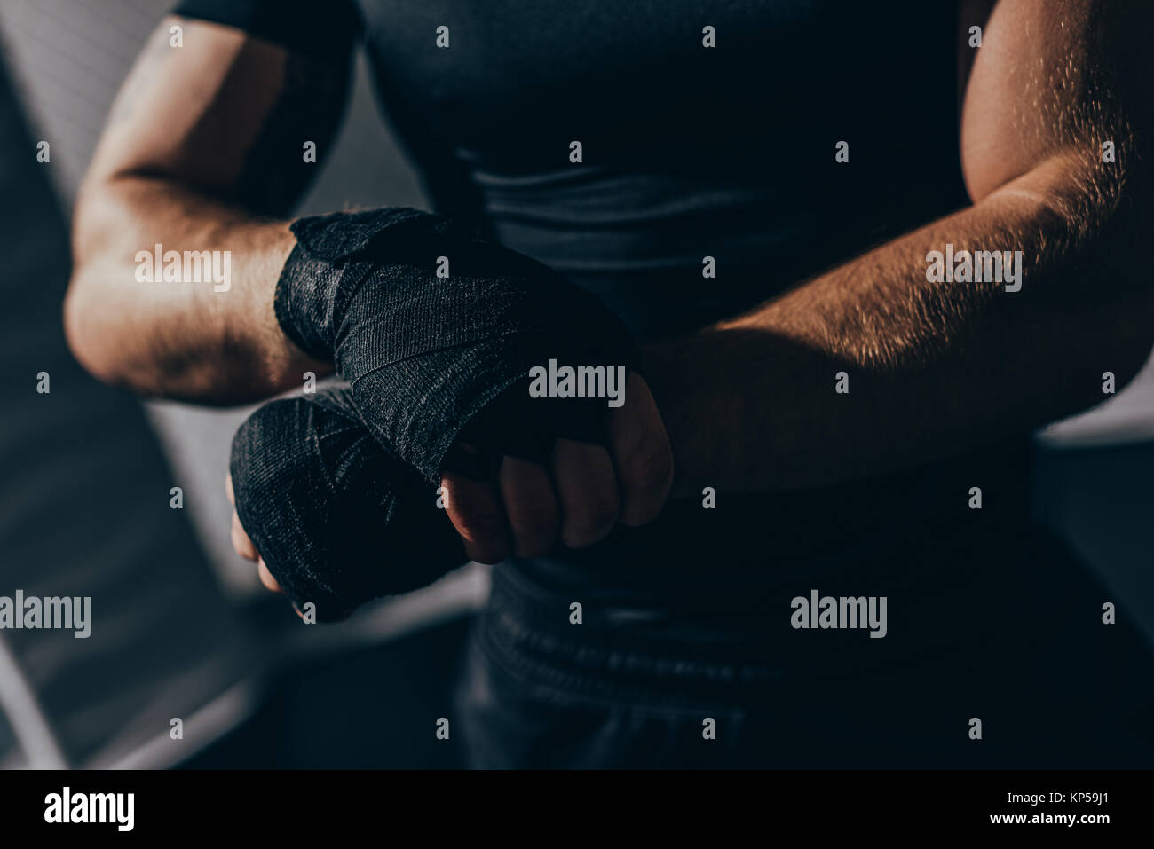 boxer wrapping hands with bandages Stock Photo - Alamy