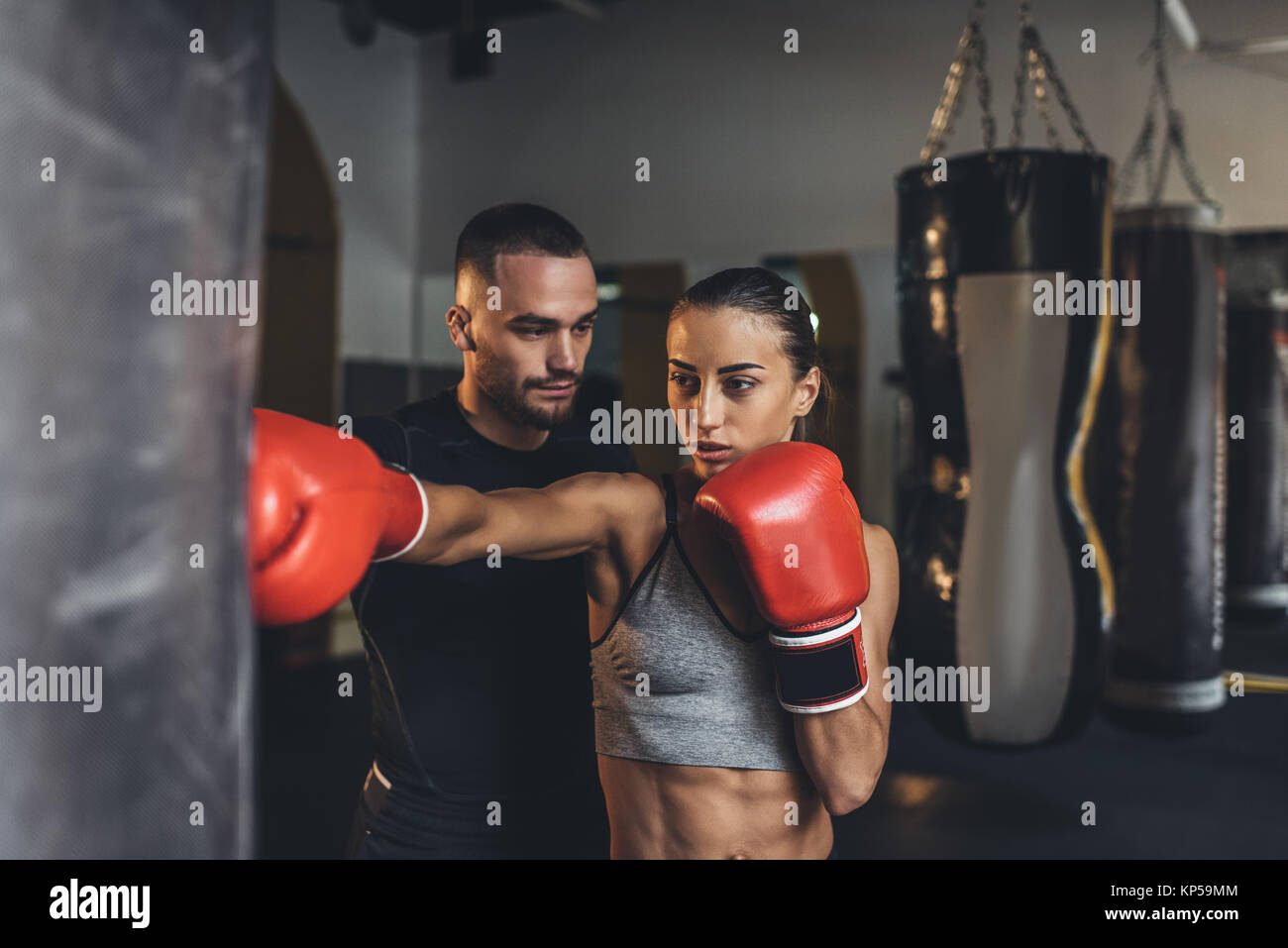trainer and female boxer Stock Photo - Alamy