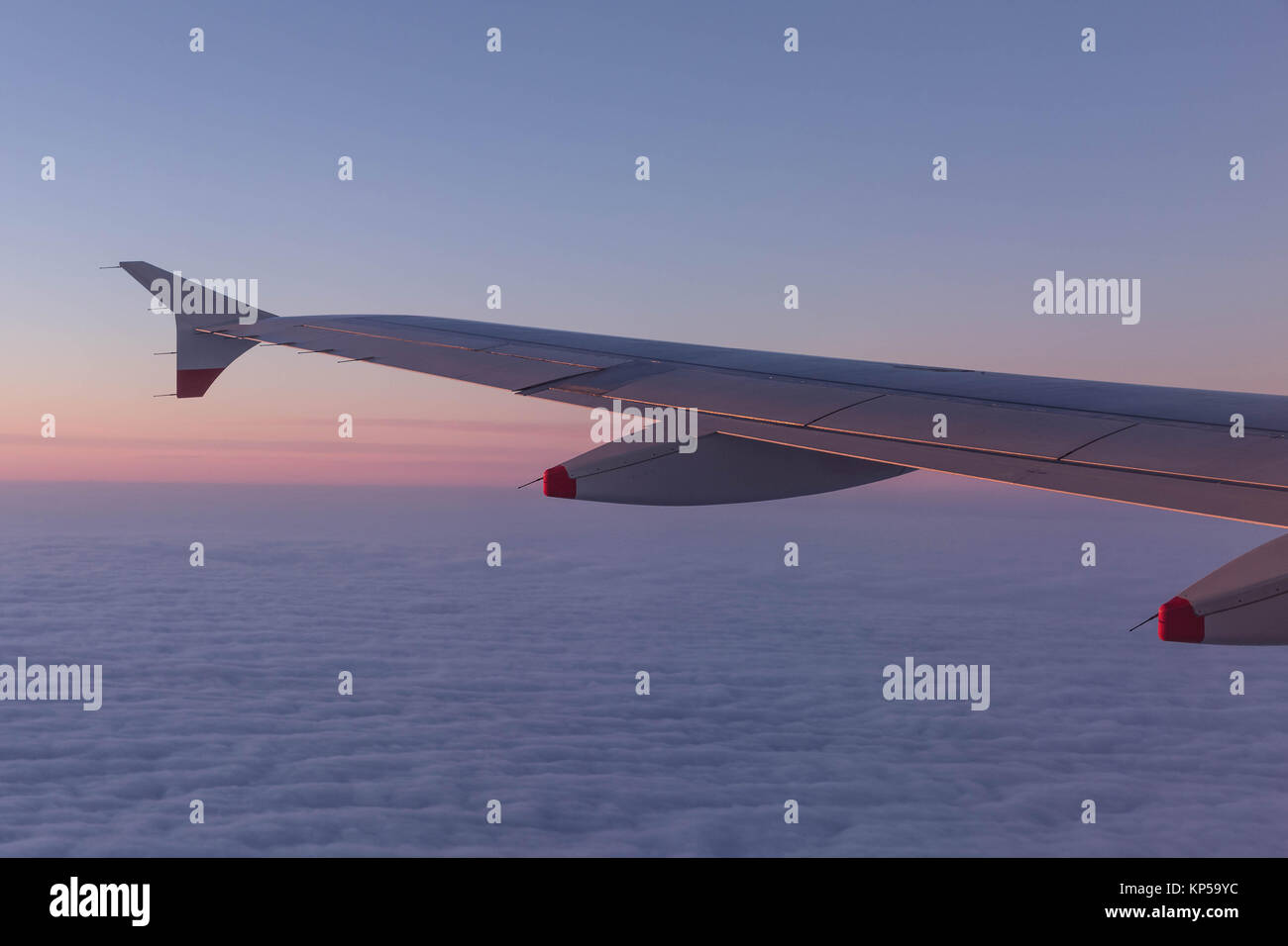 Aircraft wing over clouds, flying background clouds over USA Stock ...