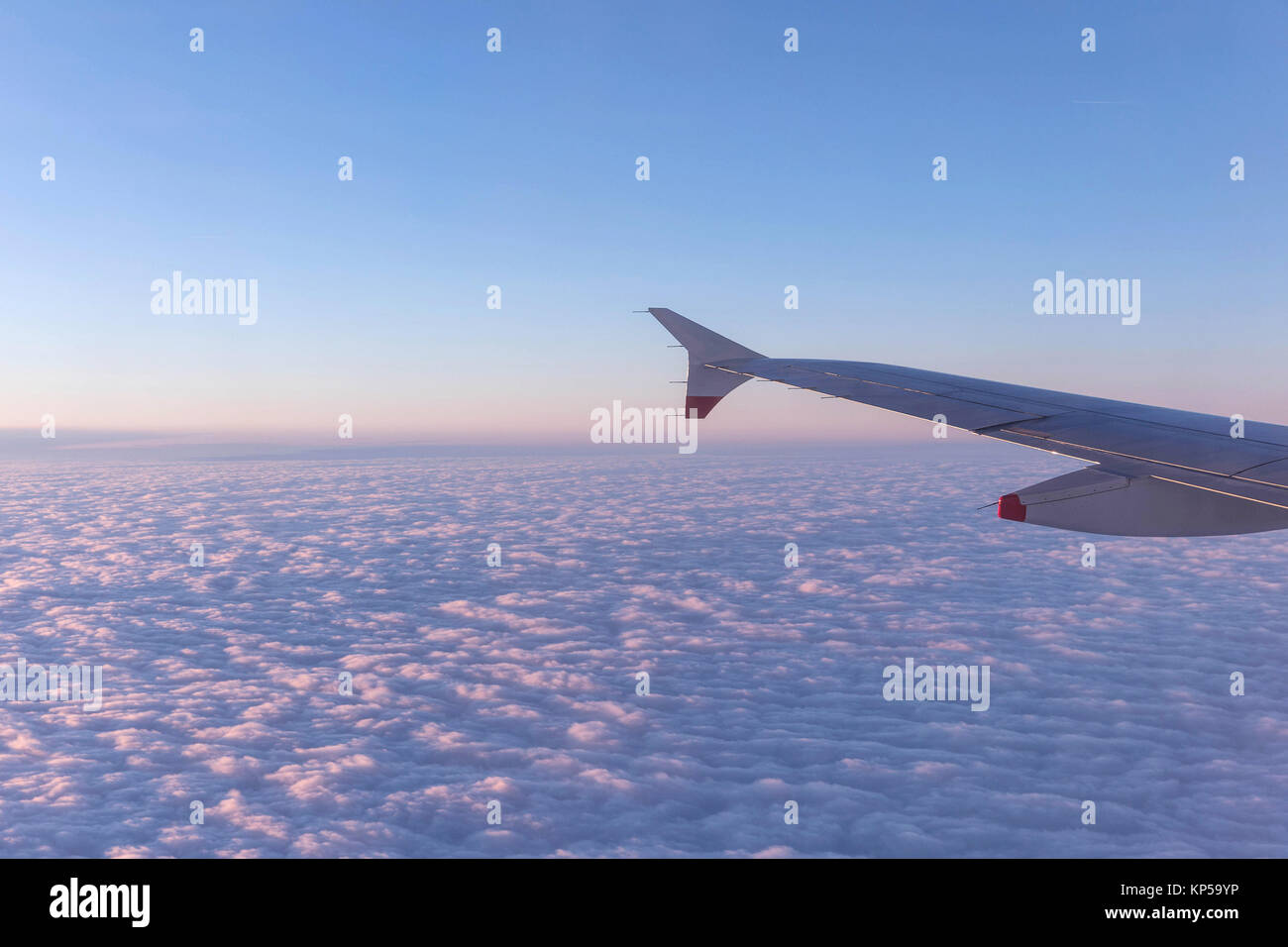 Aircraft wing over clouds, flying background clouds over USA Stock ...
