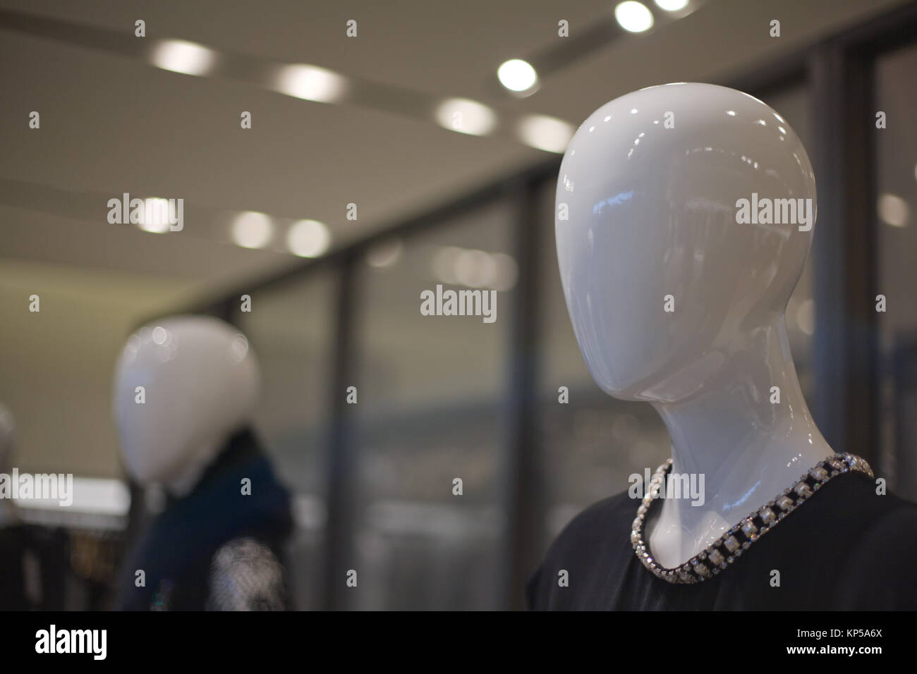Boutique with mannequins without face in fashionable dresses Stock ...