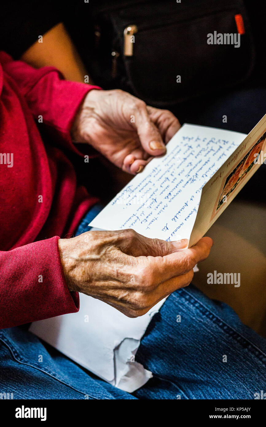 Elderly woman reading a letter Stock Photo - Alamy