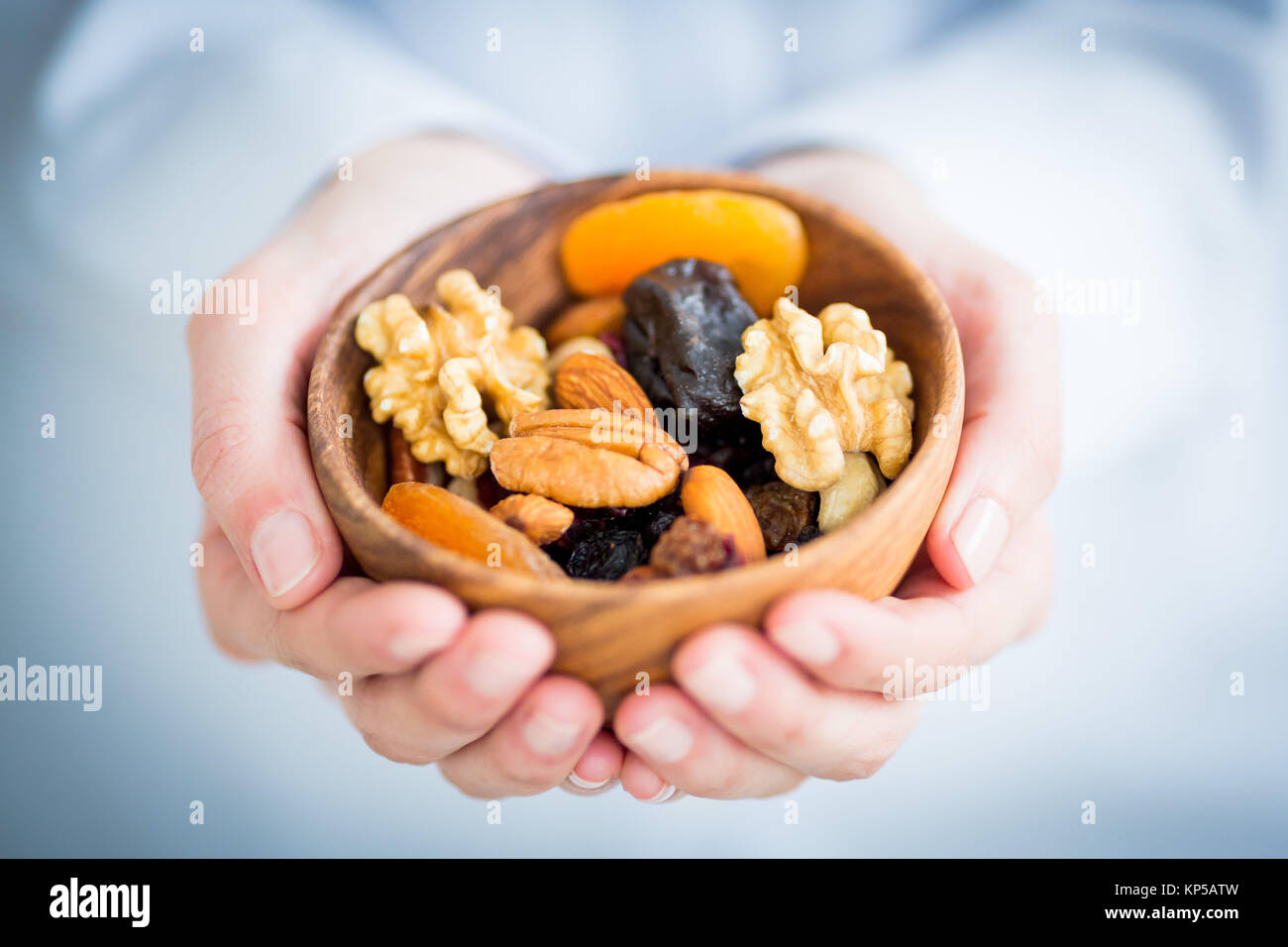 Woman eating fruit and nuts hi-res stock photography and images - Alamy