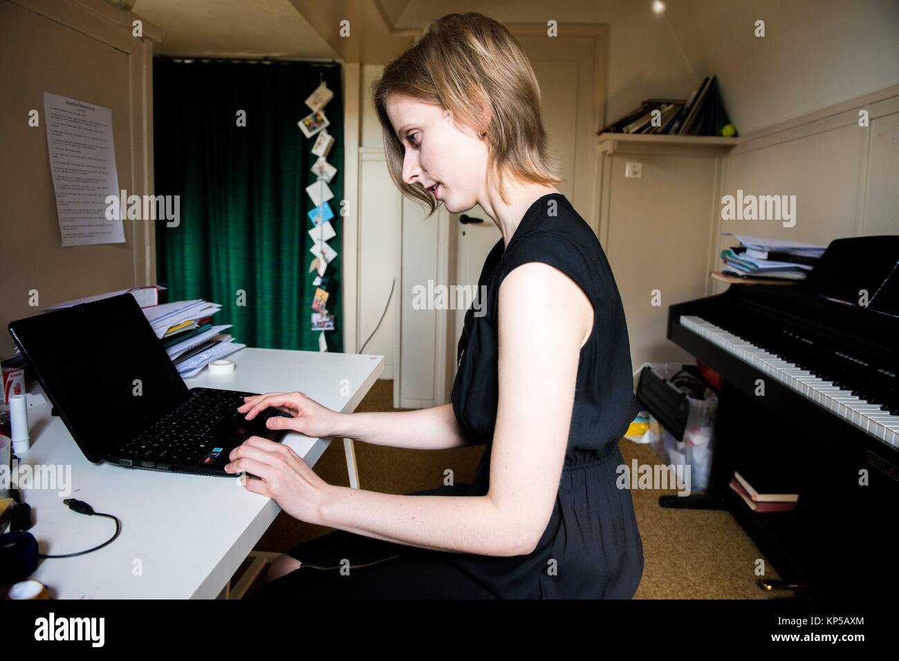 Teacher sitting behind desk hi-res stock photography and images - Alamy