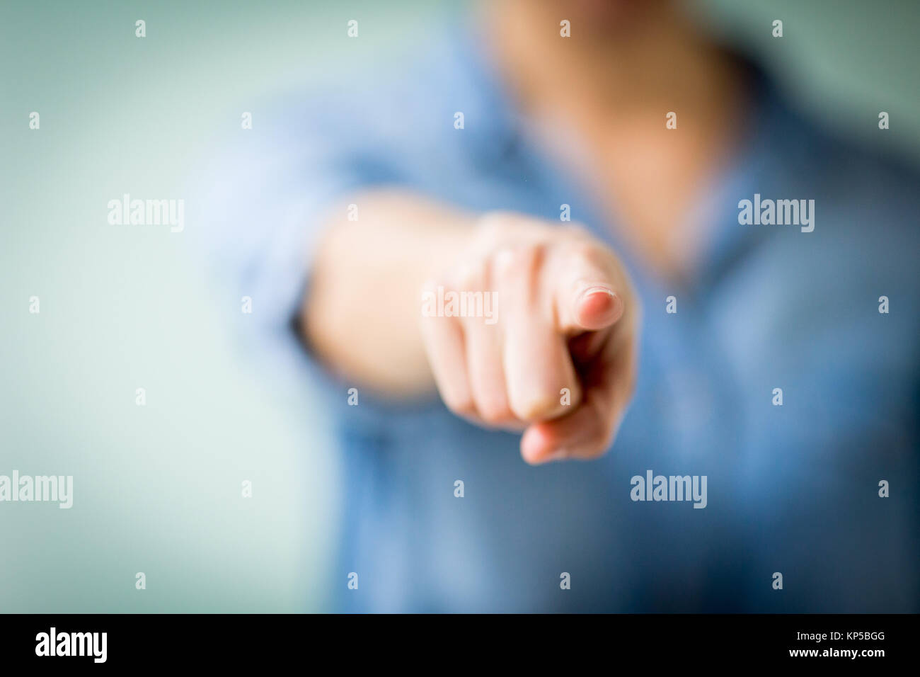 Woman pointing finger Stock Photo - Alamy