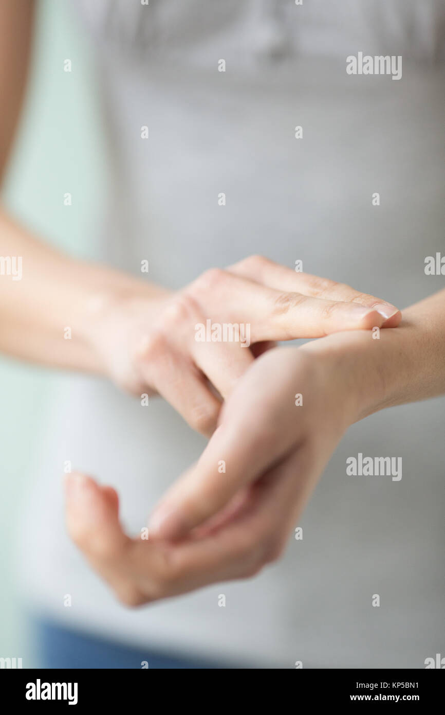 Woman checking pulse Stock Photo - Alamy