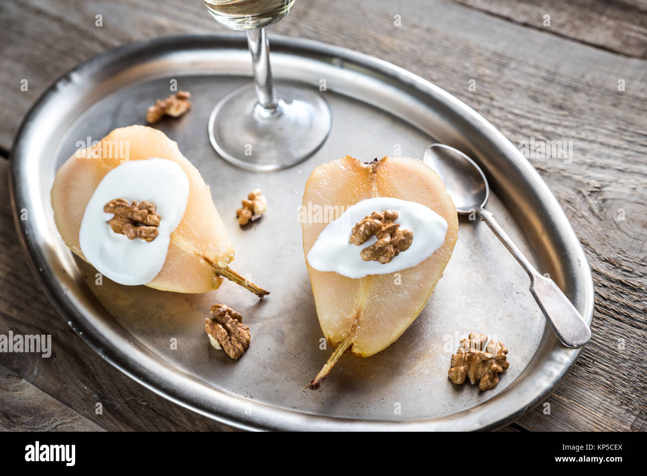 Halves of poached pear Stock Photo - Alamy
