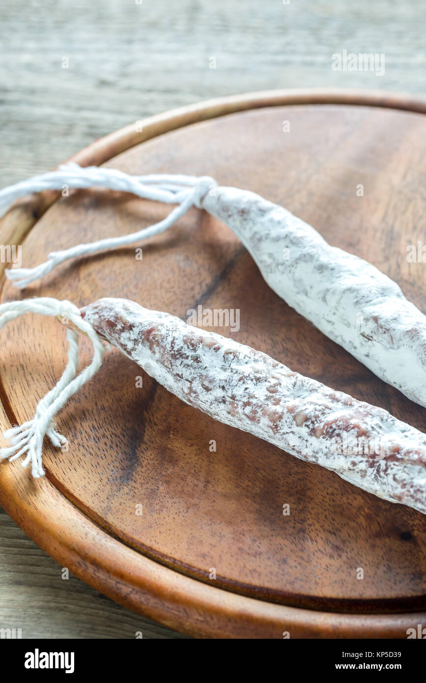 Spanish fuet on the wooden board Stock Photo - Alamy