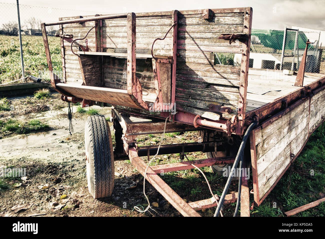 Old farm rusty trailer Stock Photo - Alamy