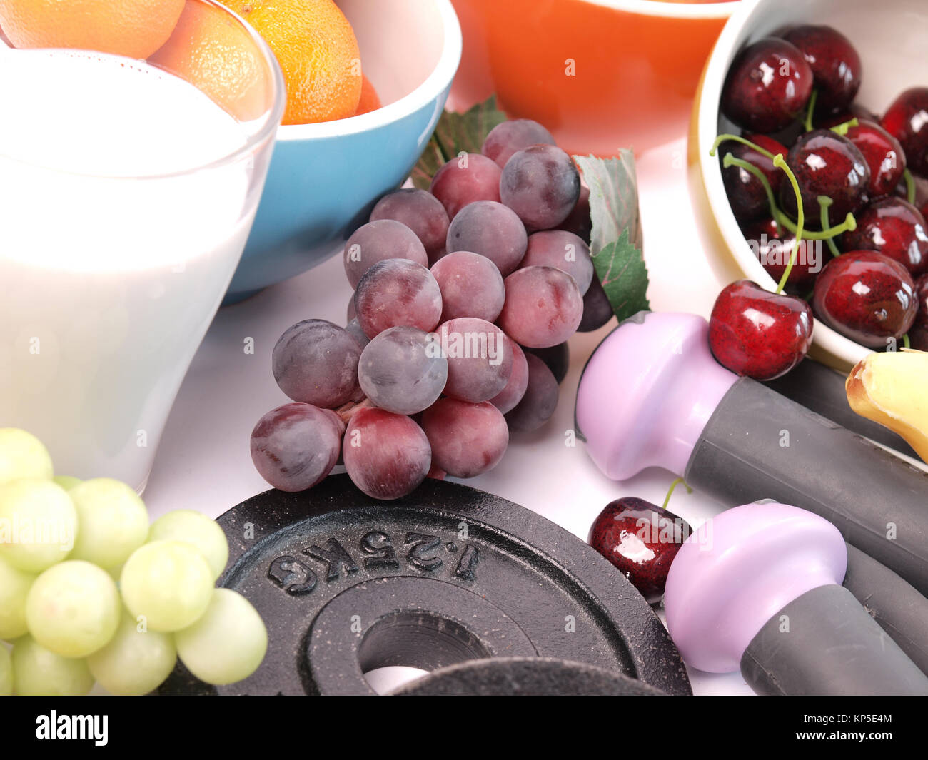 Fitness and diet concept with healthy food and sports equipment on a ...