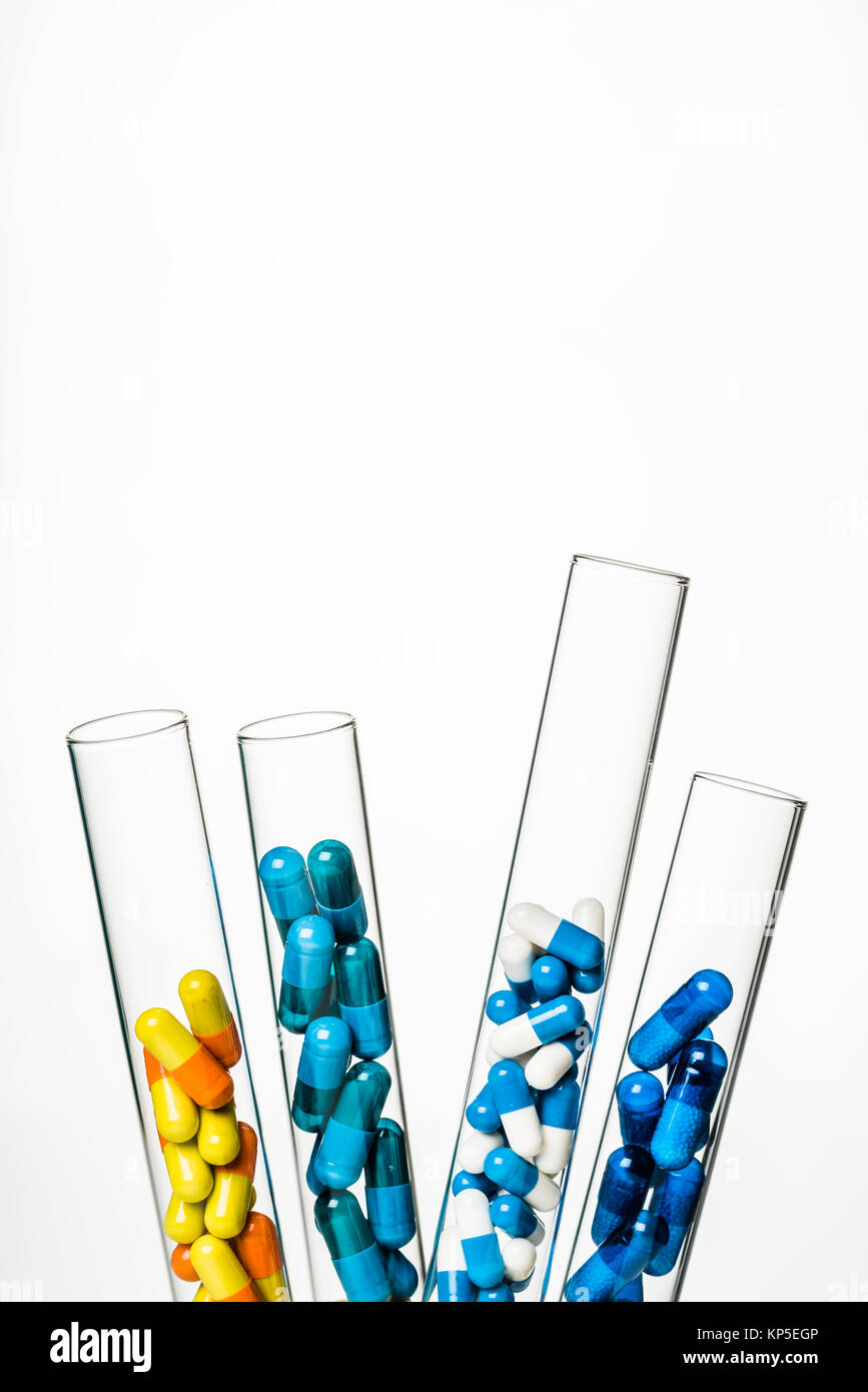 Capsules in test tubes Stock Photo - Alamy