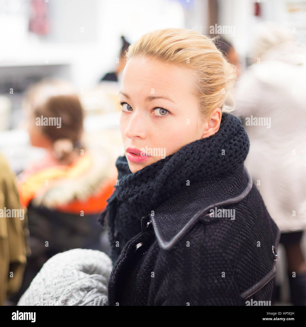 Female shopper queuing in line at cashier Stock Photo - Alamy