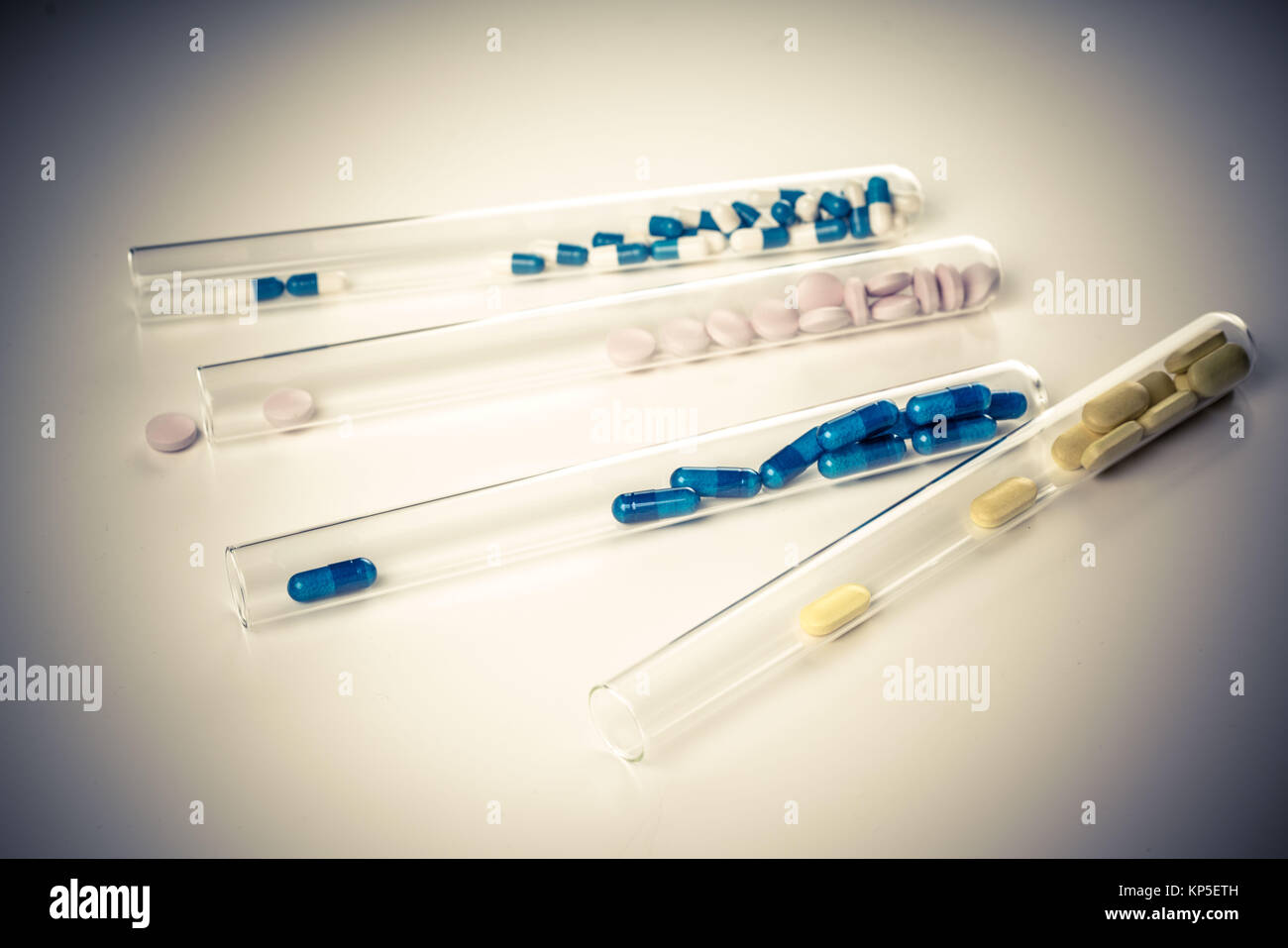 Capsules and pills in test tubes Stock Photo - Alamy