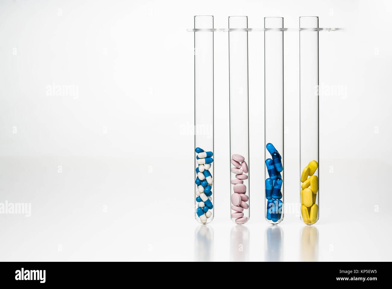 Capsules and pills in test tubes Stock Photo - Alamy