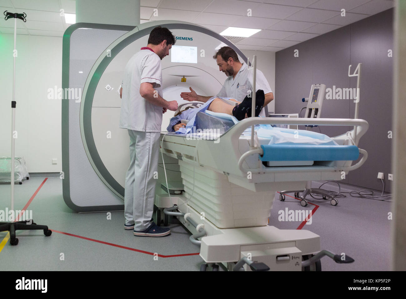 Patient in an MRI (magnetic resonance imaging) scanner, MRI of the ...