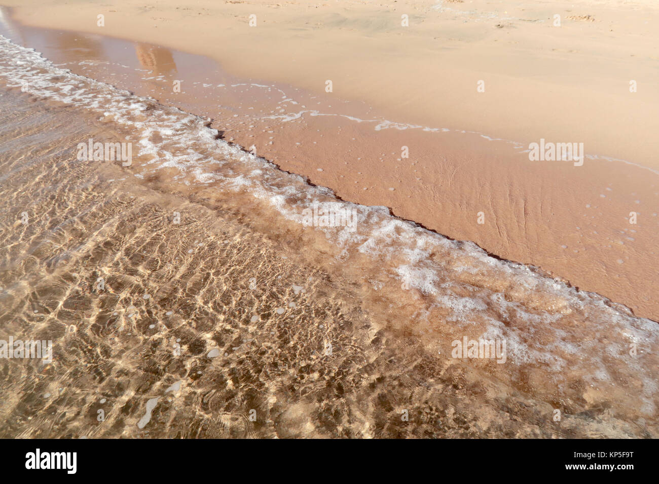 Sandy beach and sea water Stock Photo - Alamy