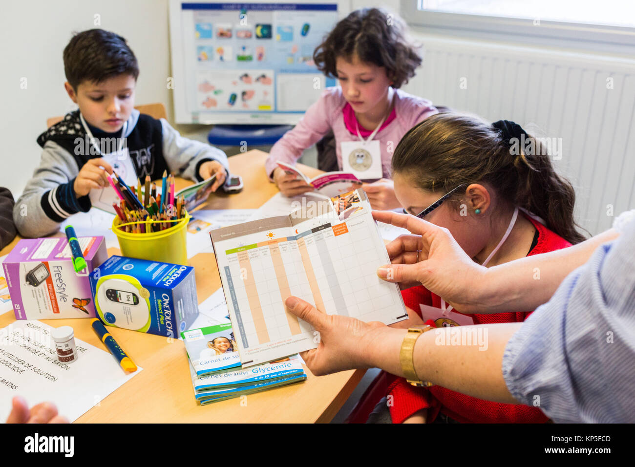 Diabetic children participating in a therapeutic education workshop ...
