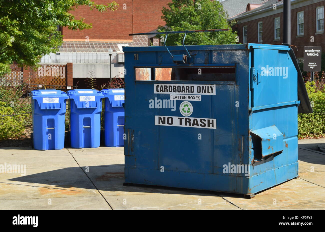 blue container for cardboard recycling with smaller containers in the ...
