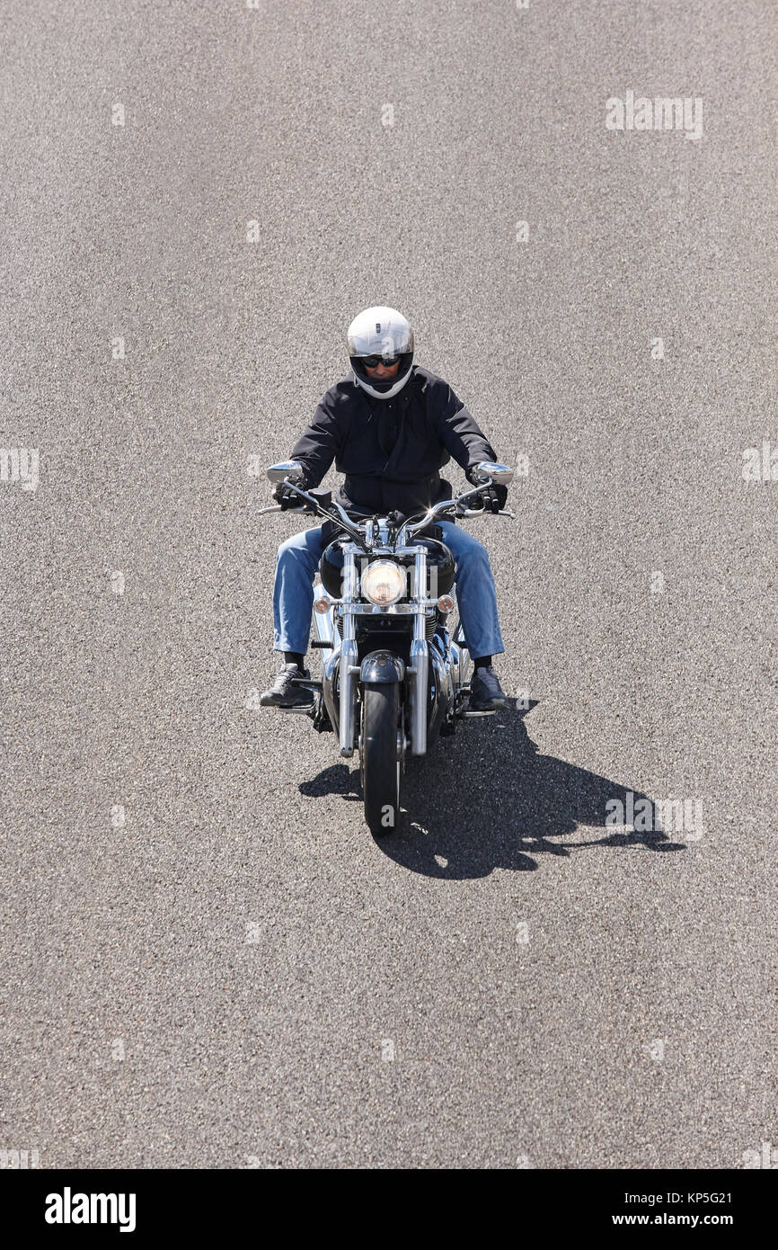 Motorcycle rider on the road. Travel and fun background. Vertical Stock ...