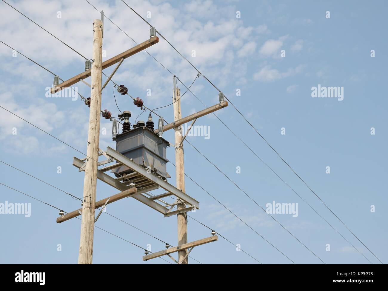 Transformer isolated between to power line poles Stock Photo - Alamy