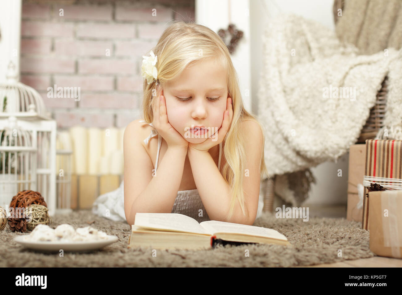 Child girl reading a book Stock Photo - Alamy