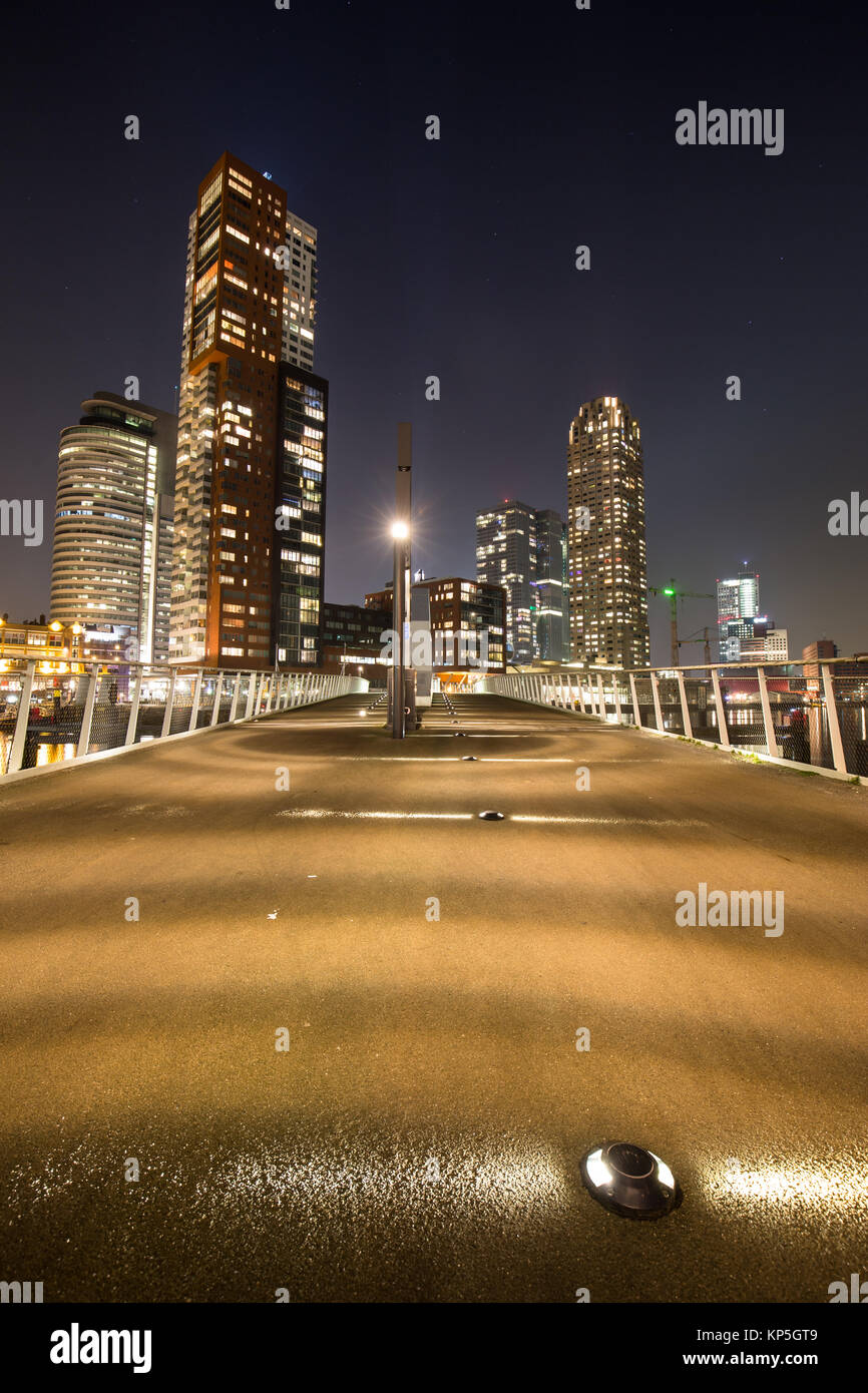 Illuminated walking bridge in Rotterdam at night. Vertical, nobody ...