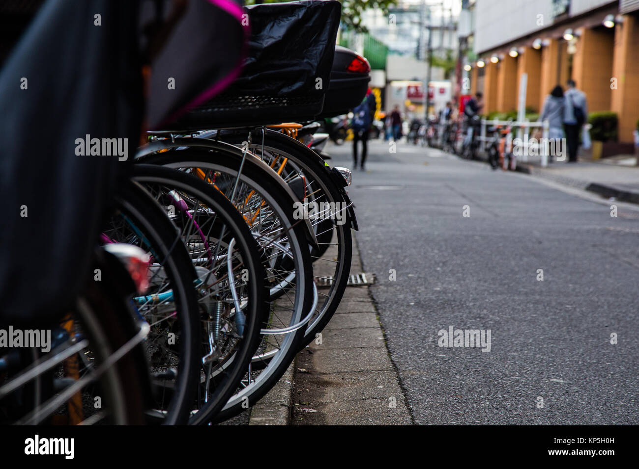 bicycles parked in a row on a side street in Shinjuku, Tokyo, Japan ...