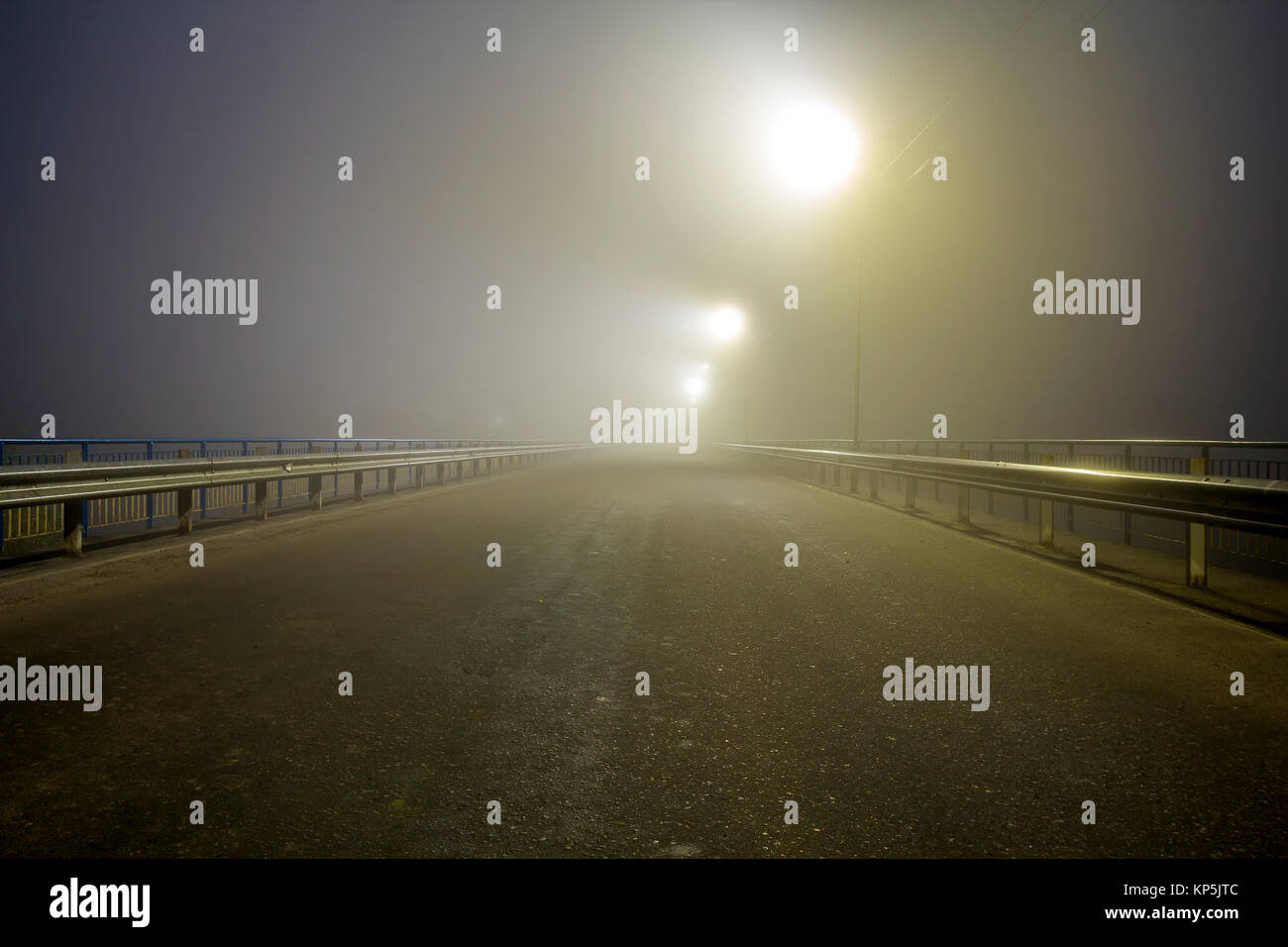 Thick fog over empty road at night Stock Photo - Alamy