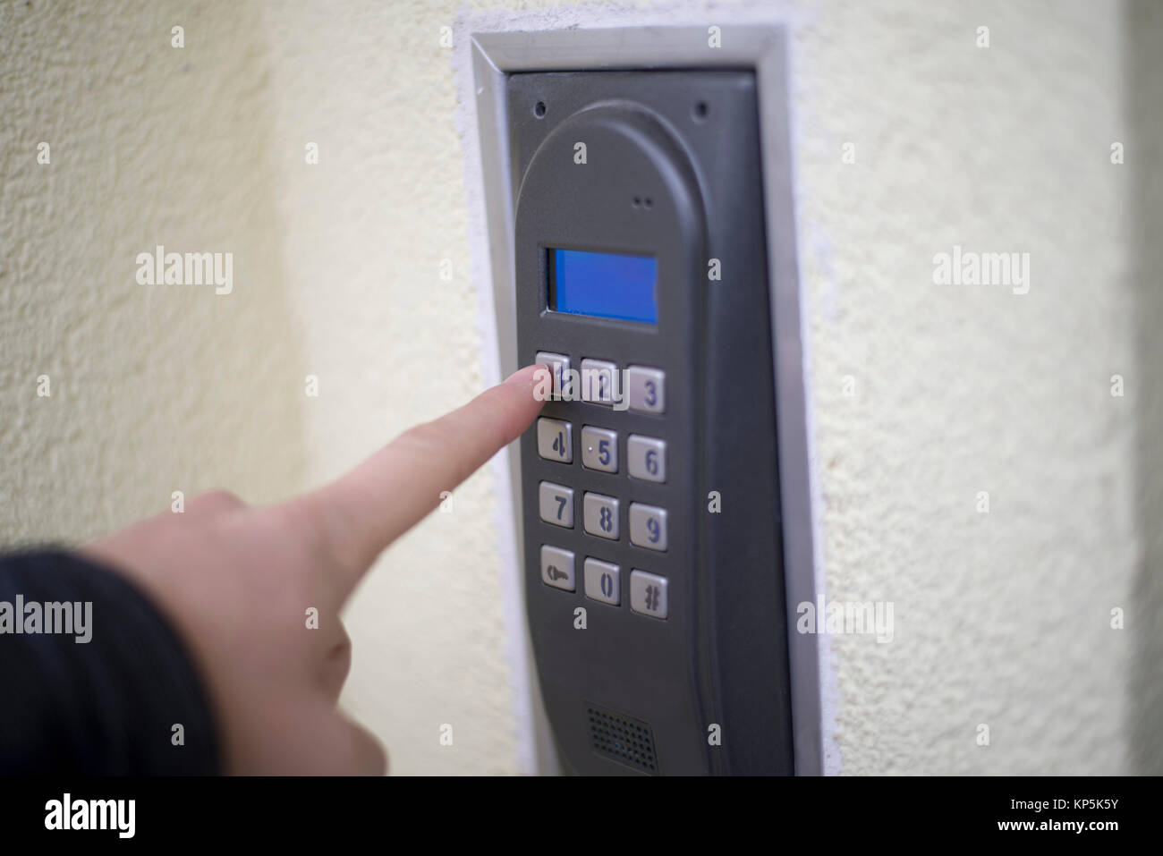 Human finger pushing button of house intercom Stock Photo - Alamy