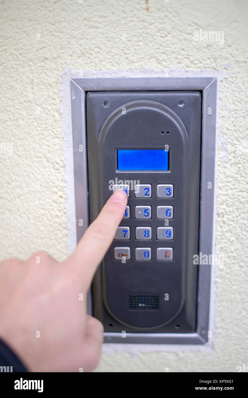 Human finger pushing button of house intercom Stock Photo - Alamy