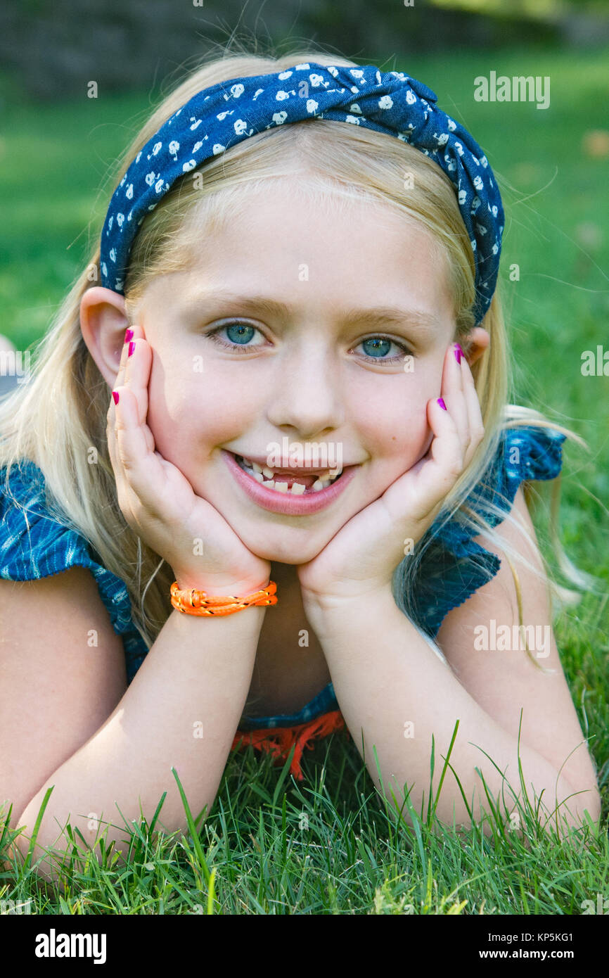adorable school age girl showing off missing front two baby teeth Stock ...