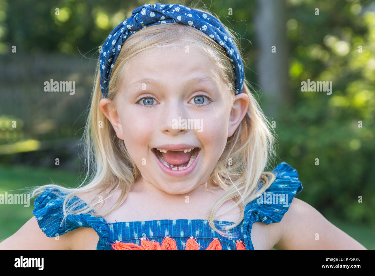 adorable school age girl showing off missing front two baby teeth Stock ...