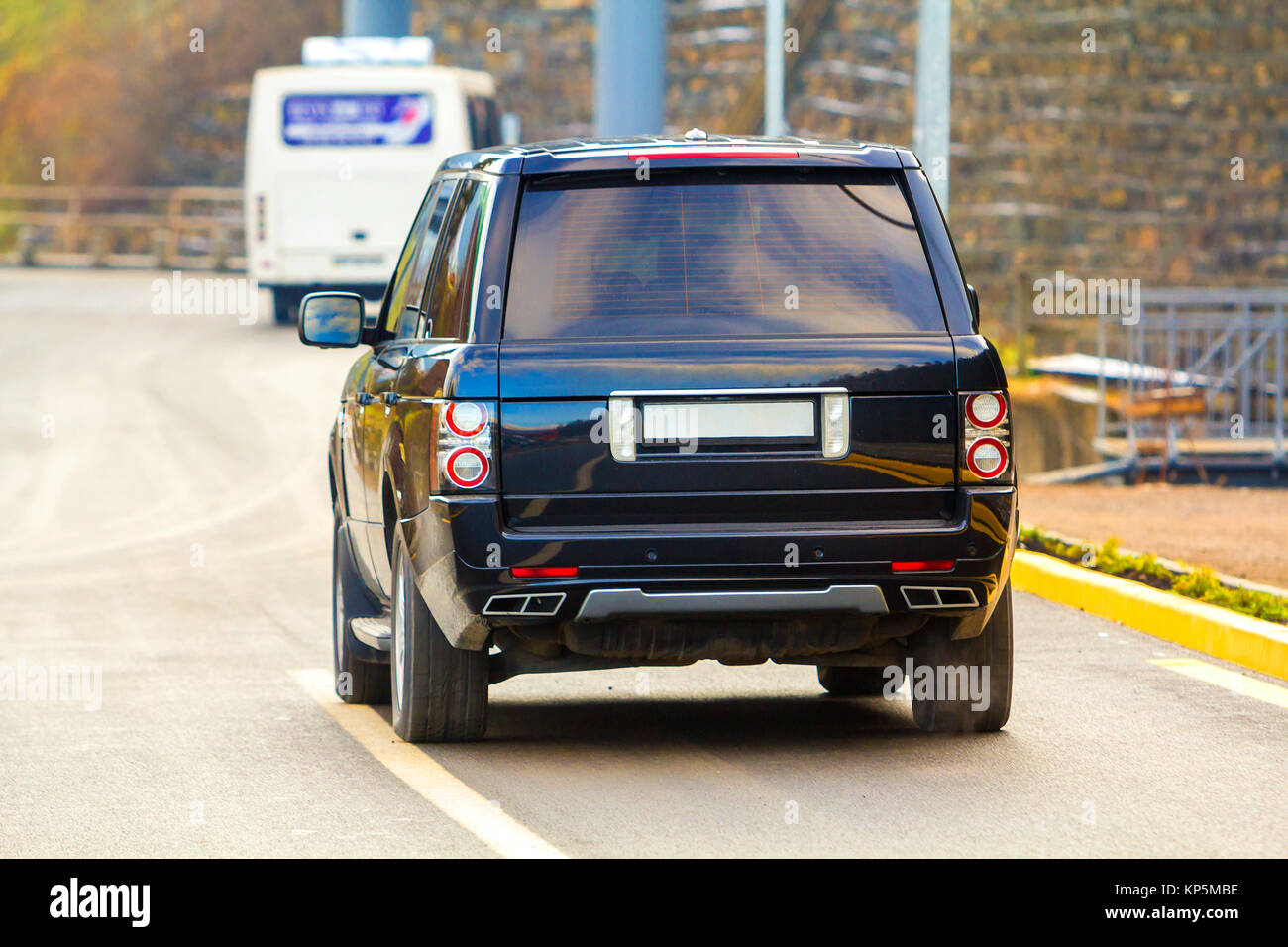 Back of new black SUV car parking on the asphalt road Stock Photo - Alamy