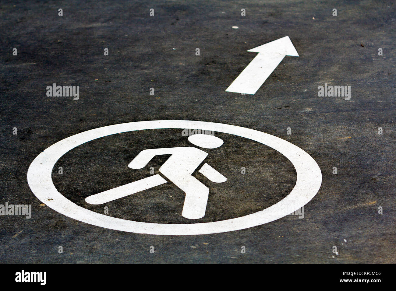 Walk way sign on the asphalt road surface Stock Photo - Alamy