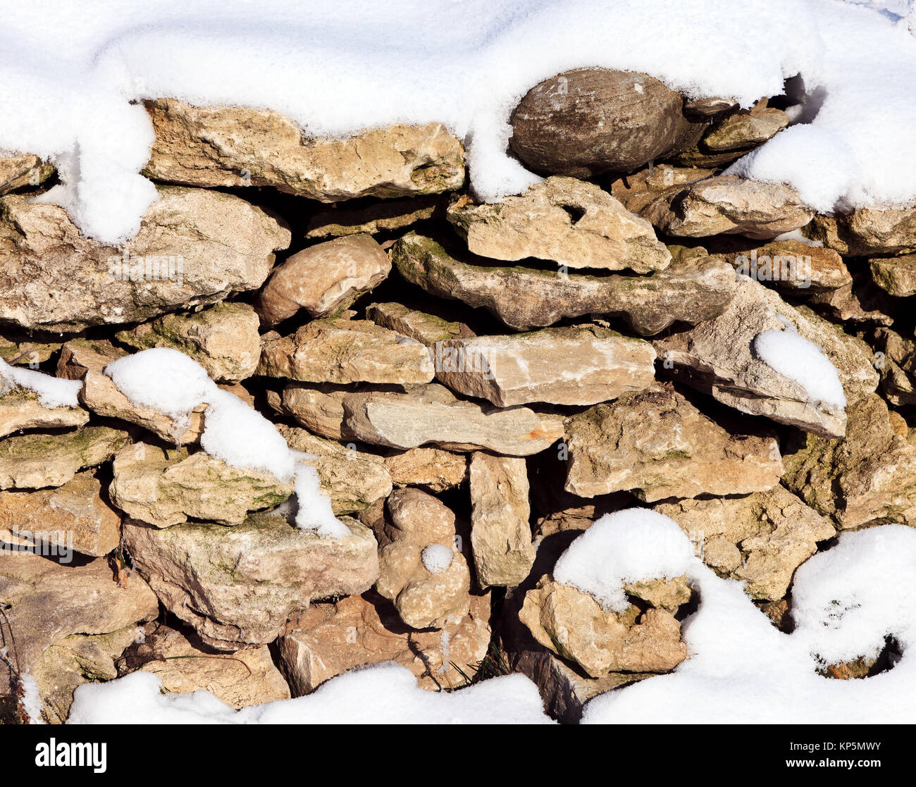 stones covered with snow Stock Photo - Alamy